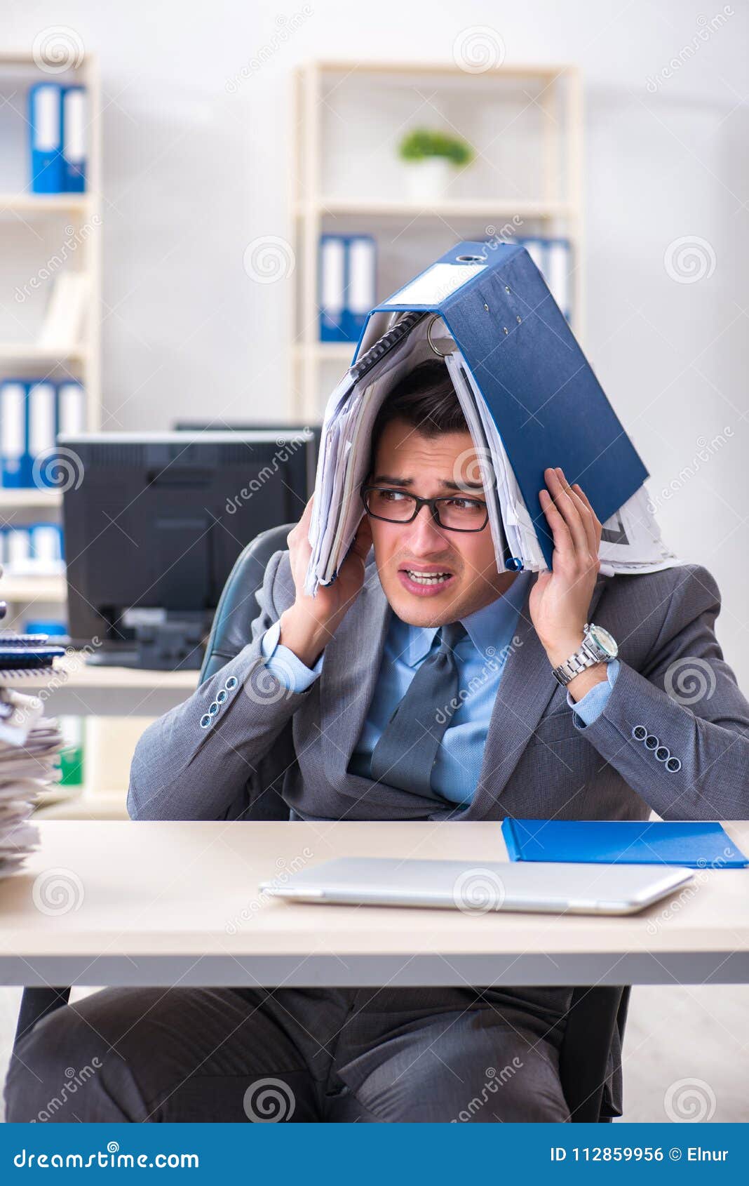 The Overloaded with Work Employee Under Paperwork Burden Stock Photo ...