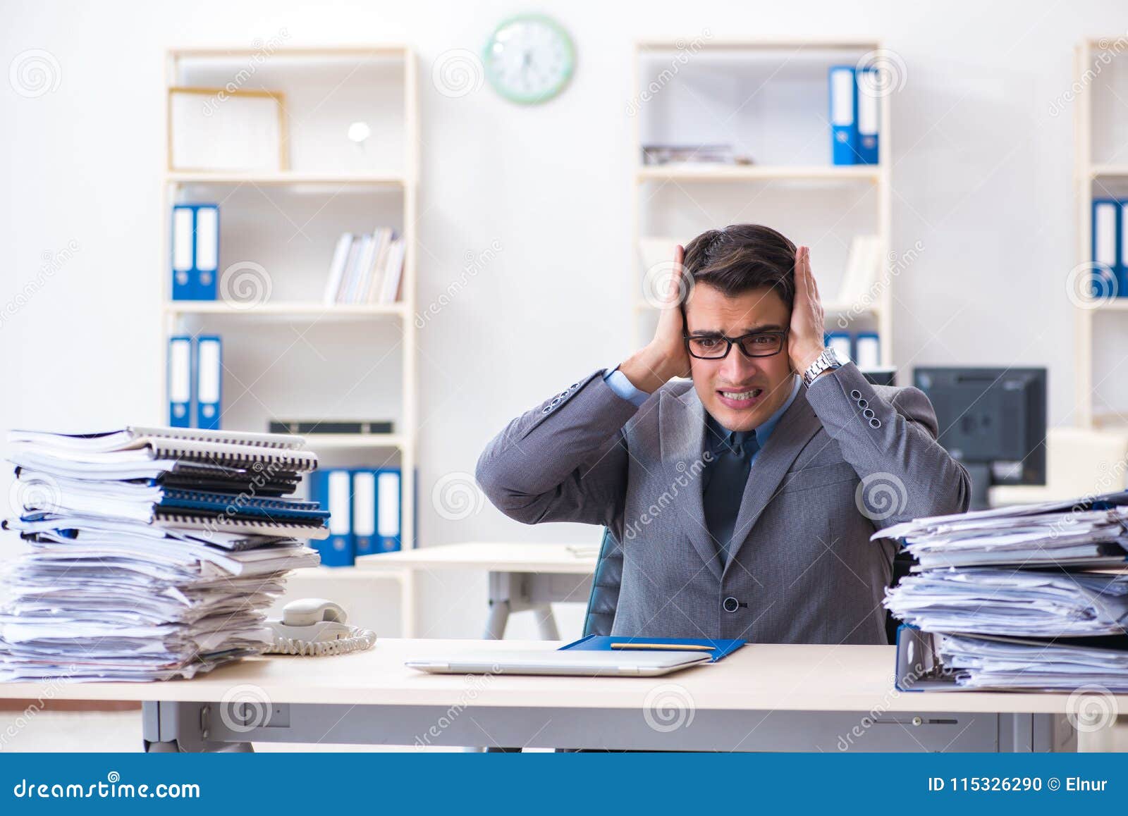 The Overloaded with Work Employee Under Paperwork Burden Stock Photo ...