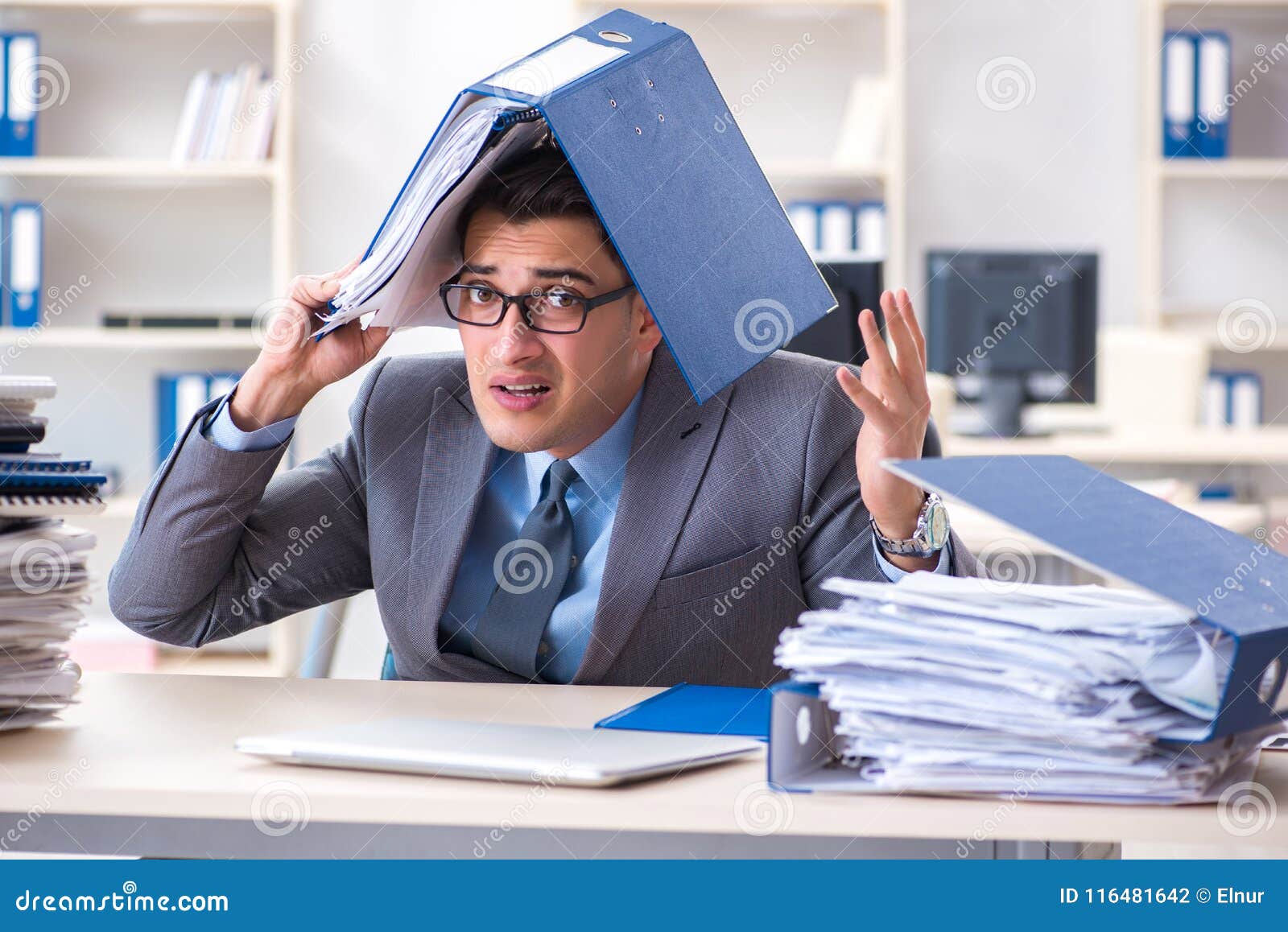 The Overloaded with Work Employee Under Paperwork Burden Stock Photo ...