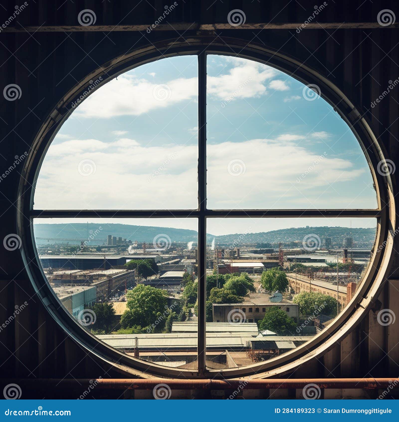 Overlooking a Bustling Manufacturing Plant through a Circular Window ...