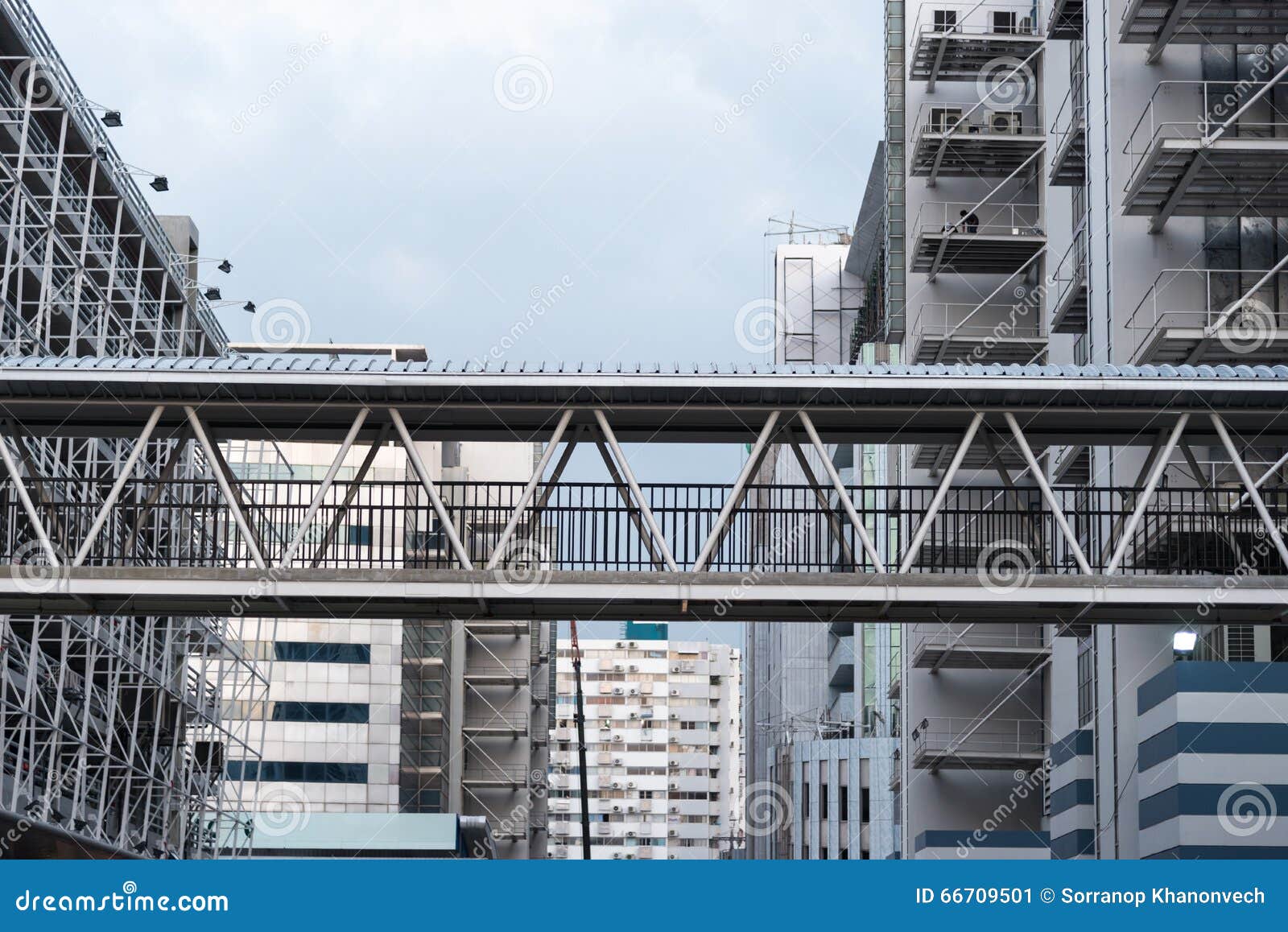 Overpass between buildings stock image. Image of street - 66709501