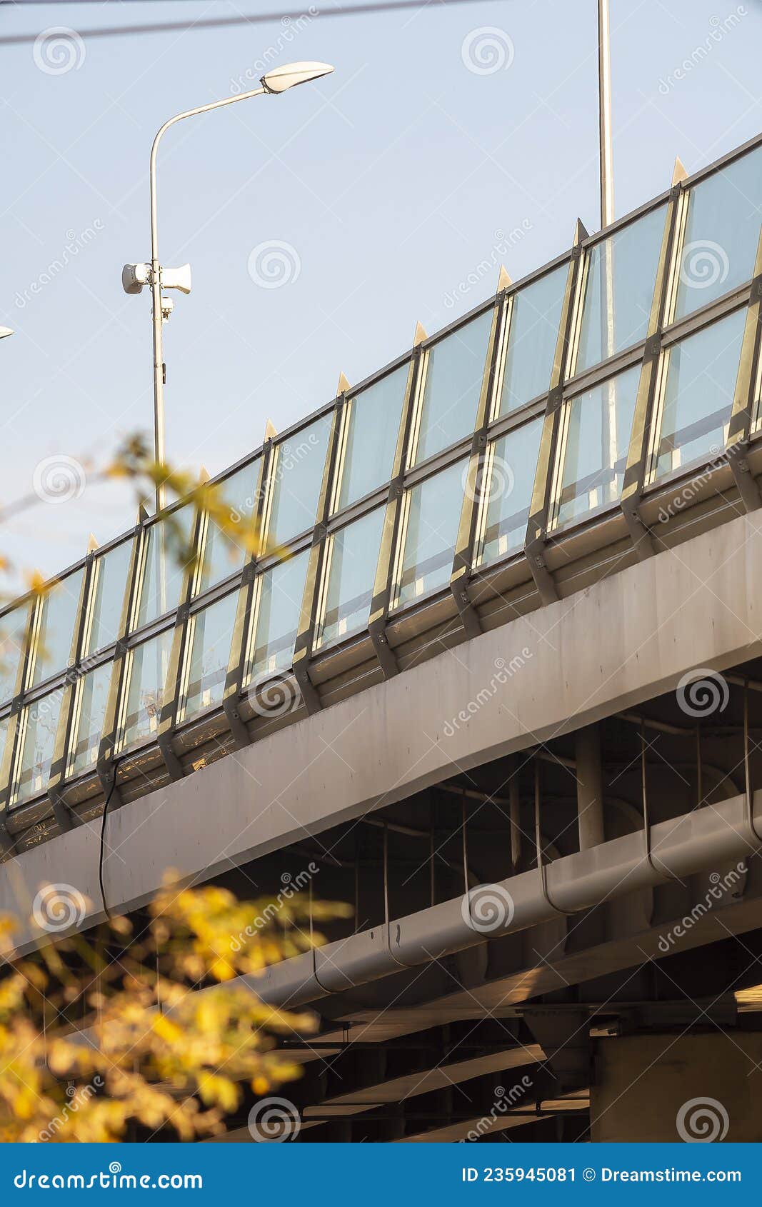 Overpass with Glass Panels Against the Blue Sky. Stock Image - Image of ...