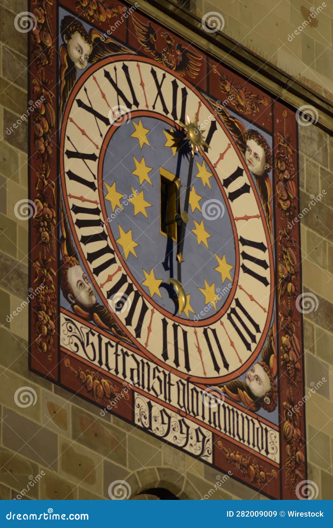 A Very Large Clock Mounted To the Side of a Building Stock Image ...