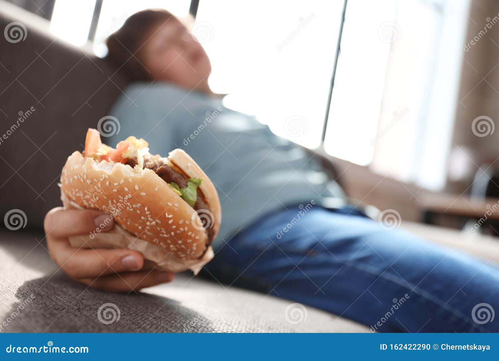 Overweight Boy with Burger Sleeping on Sofa Stock Photo - Image of ...
