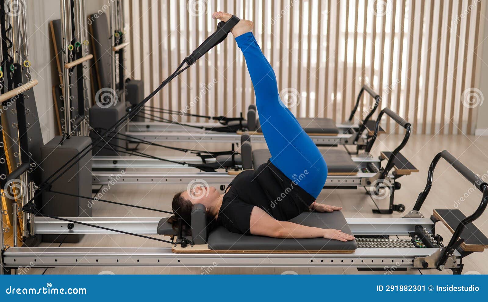 Overweight Caucasian Woman Doing Pilates Exercises on a Reformer. Stock ... Overweight Caucasian Woman Doing Pilates Exercises on a Reformer. Stock ...