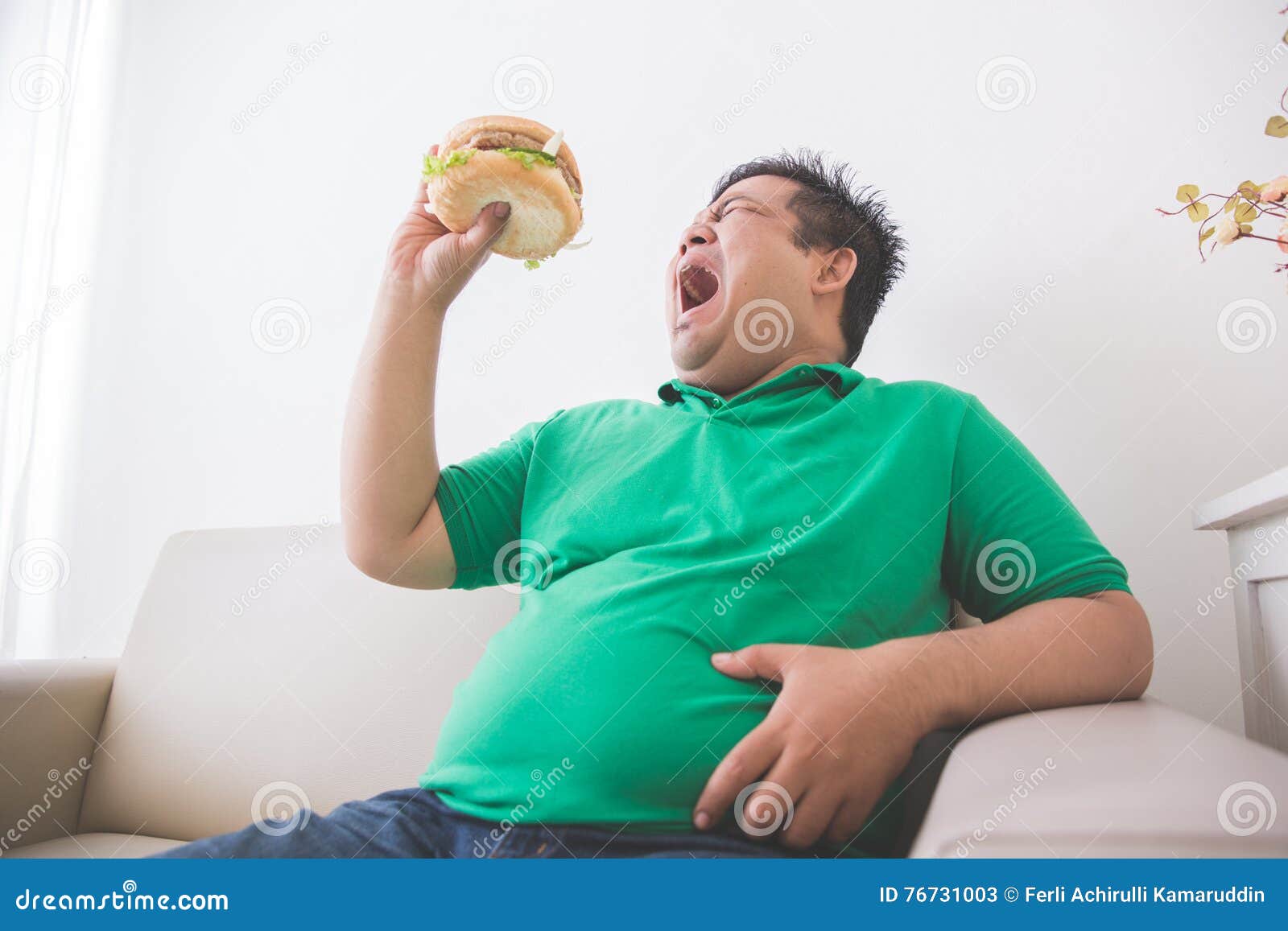 Overweight Man Eating Hamburger at Home Stock Image - Image of ...