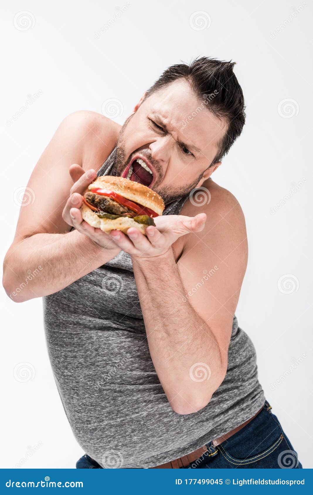 Man Making Face Expression while Posing with Burger Isolated on White ...