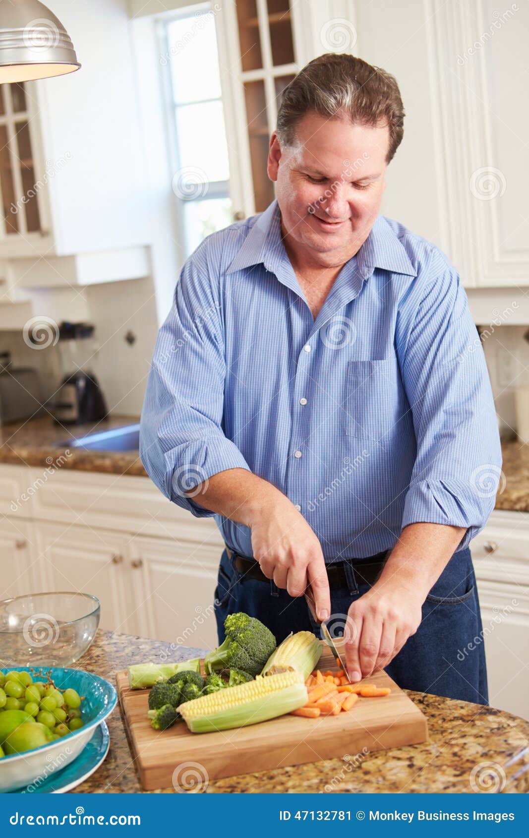 Overweight Man Preparing Vegetables in Kitchen Stock Image - Image of ...