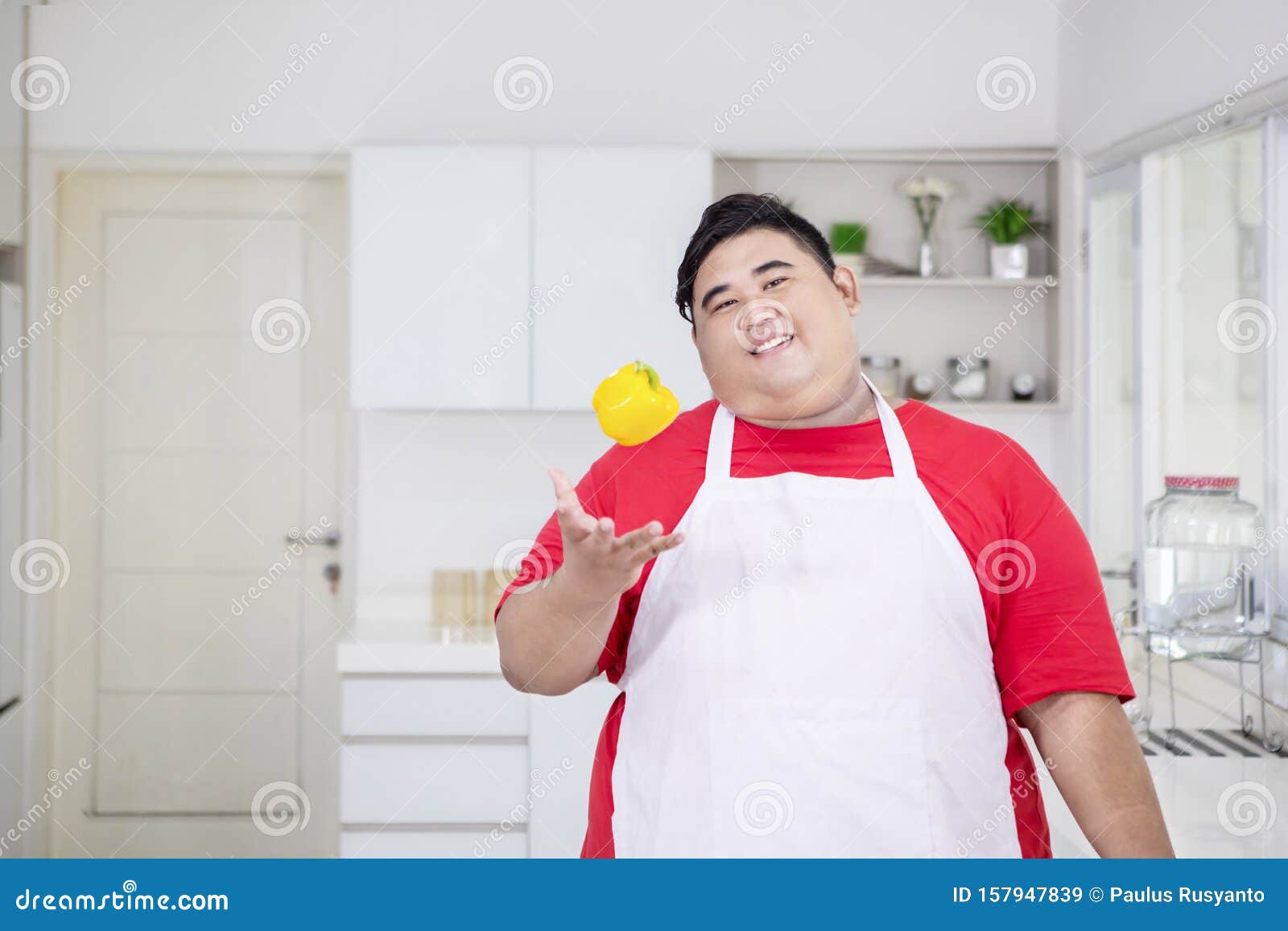 Overweight Man Throws Up a Paprika in the Kitchen Stock Image - Image ...