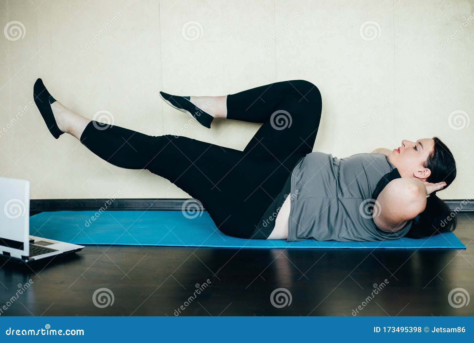 Overweight Woman Exercising Using Online Tutorial Stock Photo - Image ...