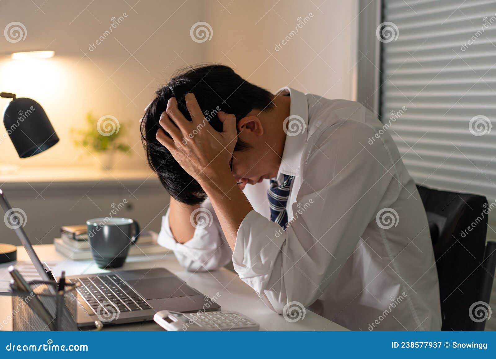 Overwork Concept the Male Who Works at the Office Tonight Holding His ...