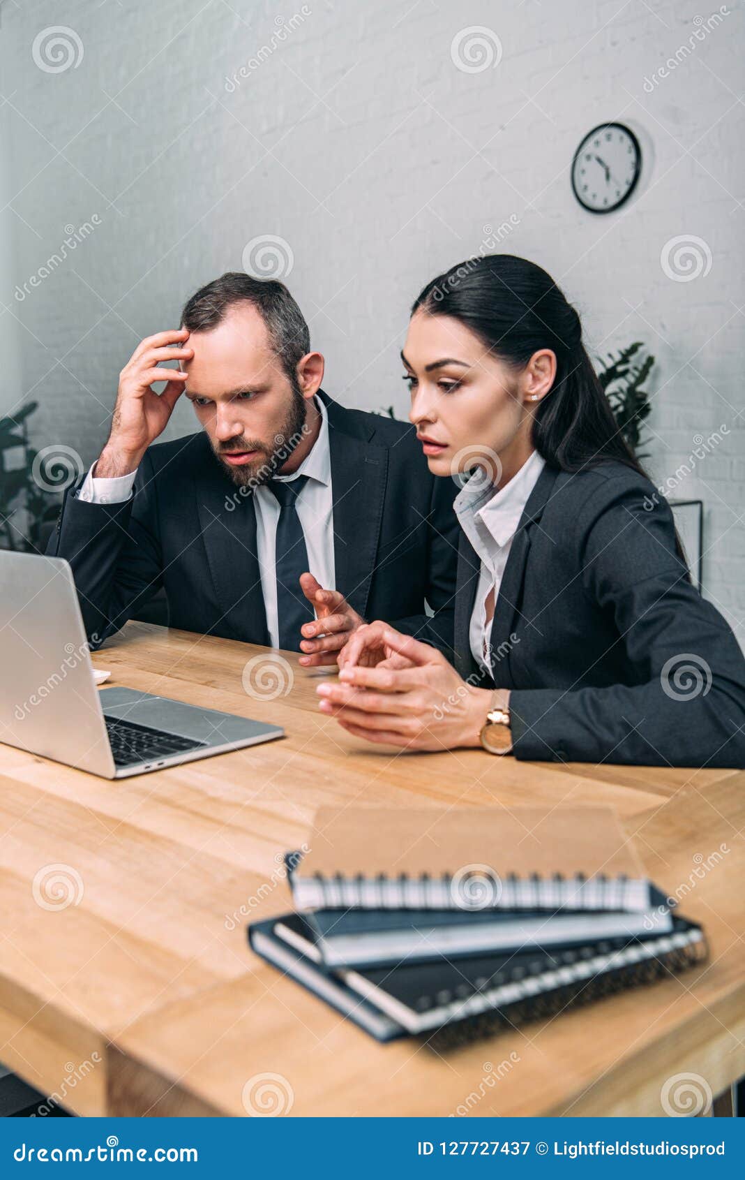 Overworked Business People Working on Laptop Together at Workplace ...