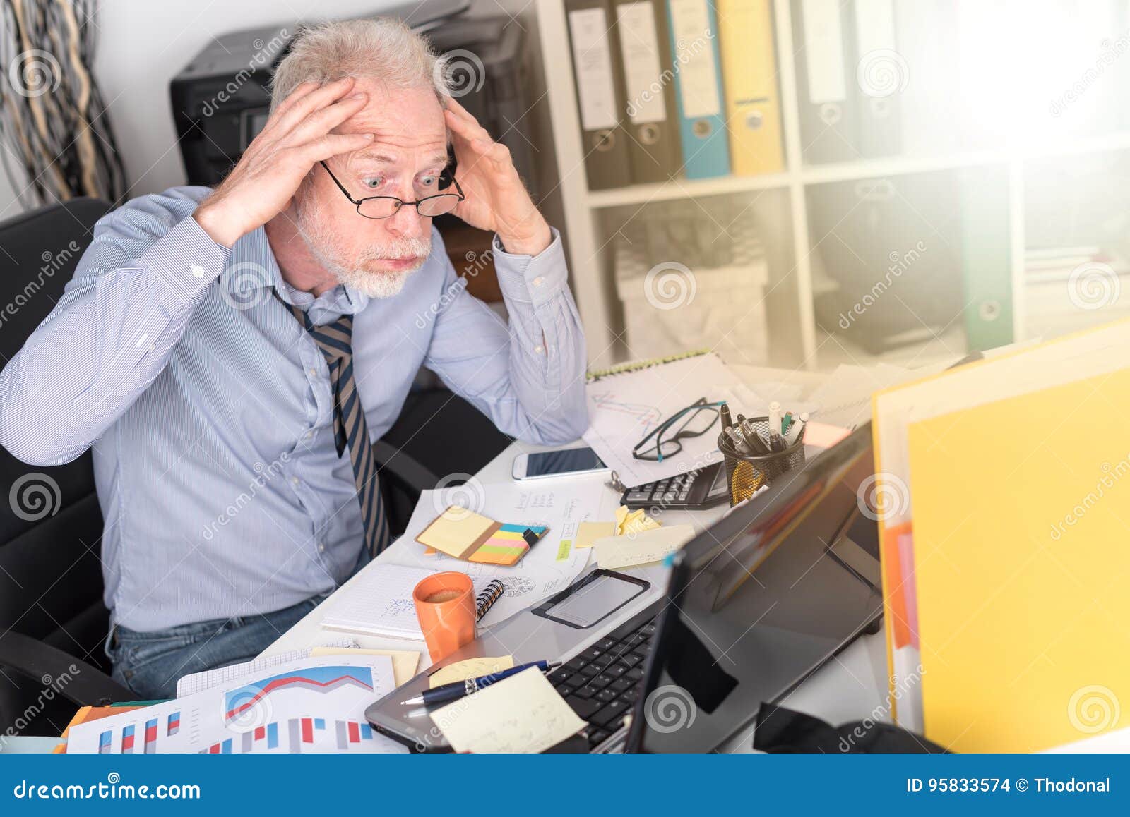 Overworked Businessman Sitting at a Messy Desk, Light Effect Stock ...