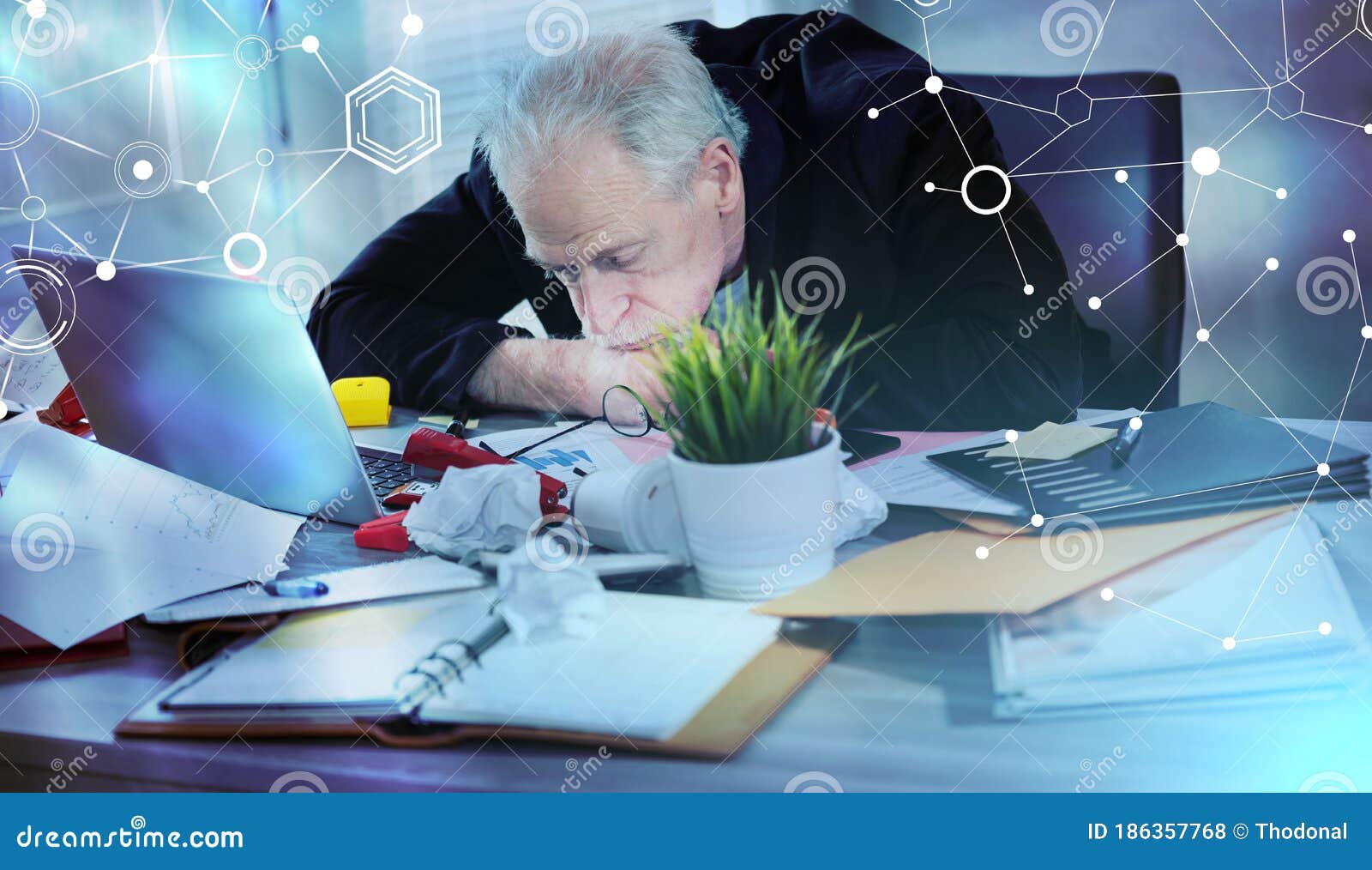 Overworked Businessman Sitting at a Messy Desk; Light Effect Stock ...