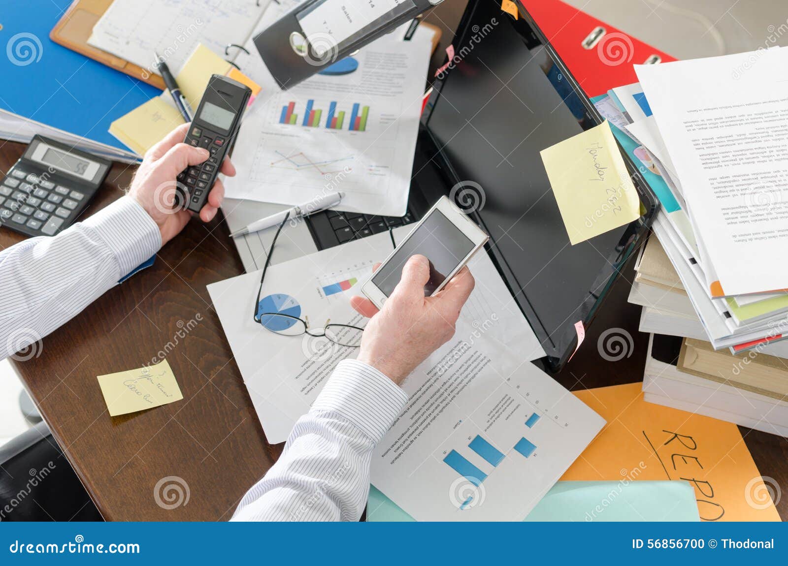 Overworked businessman stock photo. Image of clutter - 56856700