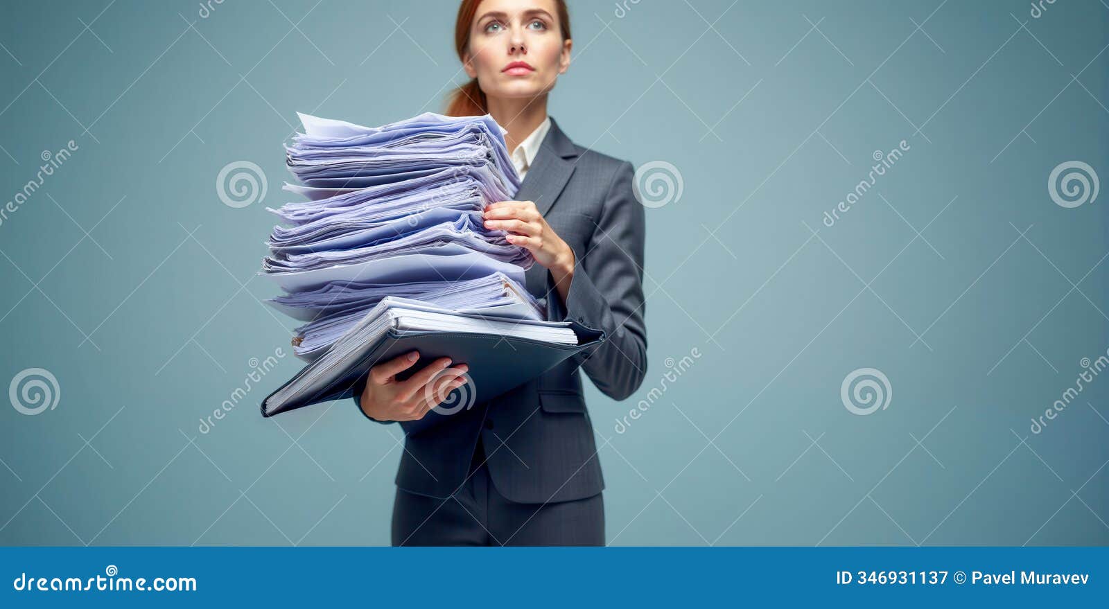 Overworked Businesswoman in Grey Suit Carrying Large Stack of Documents ...