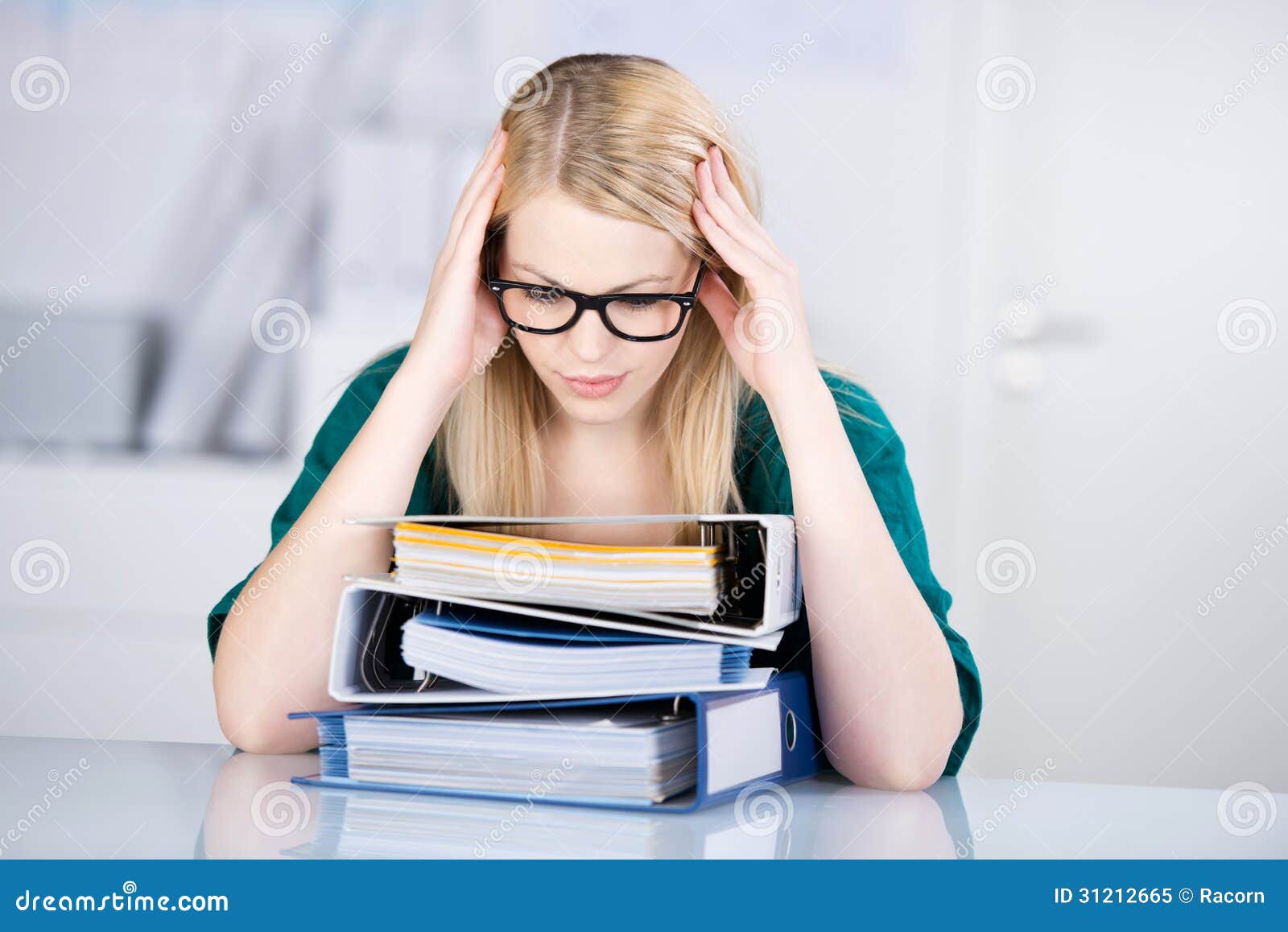 Overworked Businesswoman Looking at Stack of Binders at Desk Stock ...