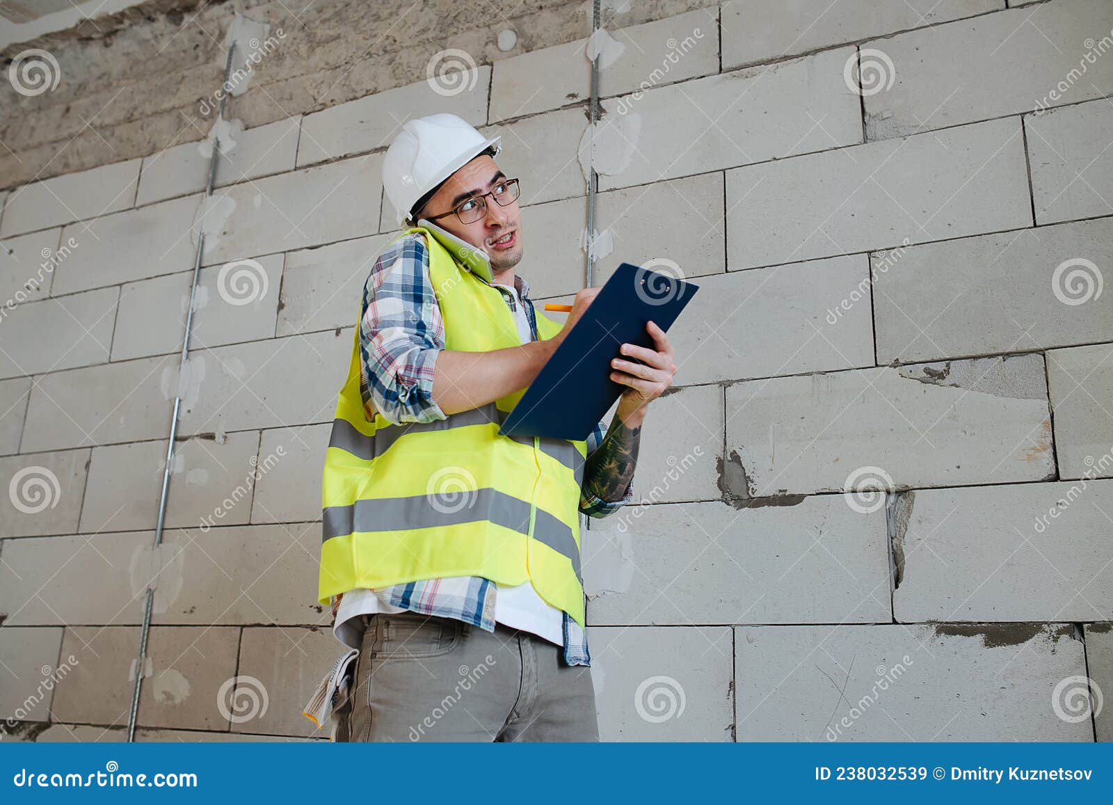 Overworked Construction Engineer Discussing Problems on the Phone ...