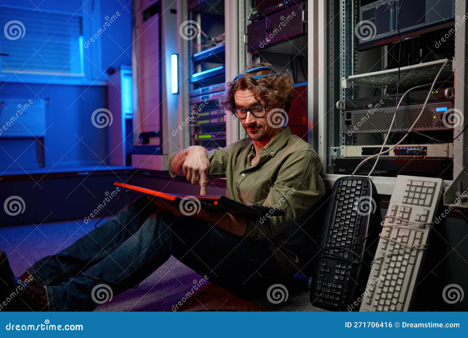 Overworked Data Center Engineer Using Keyboard on Supercomputer Server ...