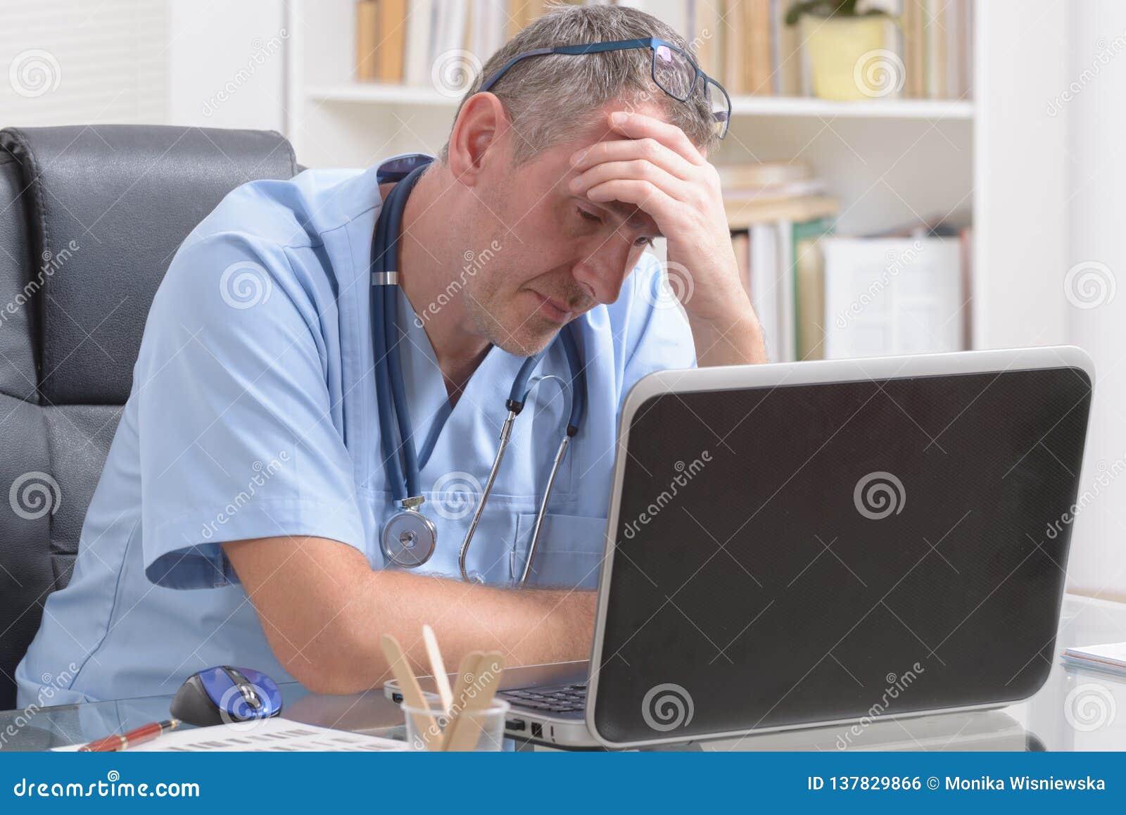 Overworked Doctor in His Office Stock Photo - Image of healthcare ...