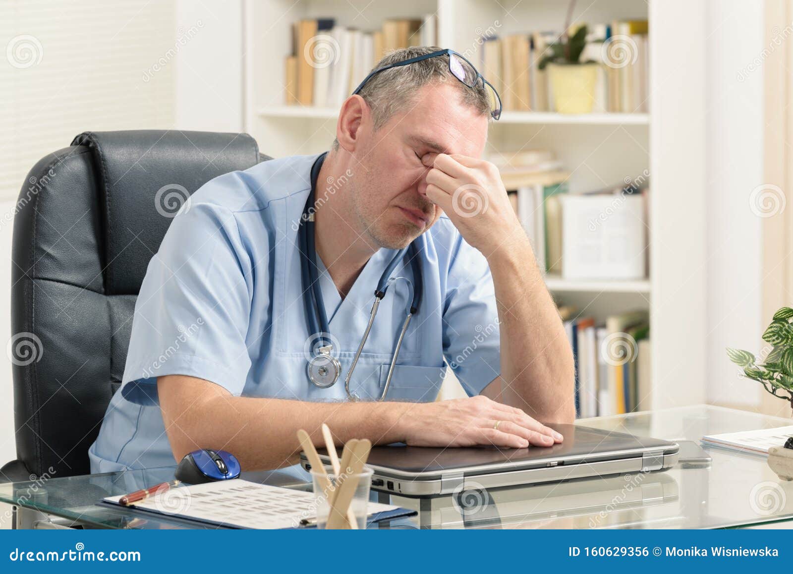 Overworked Doctor in His Office Stock Photo - Image of occupation ...