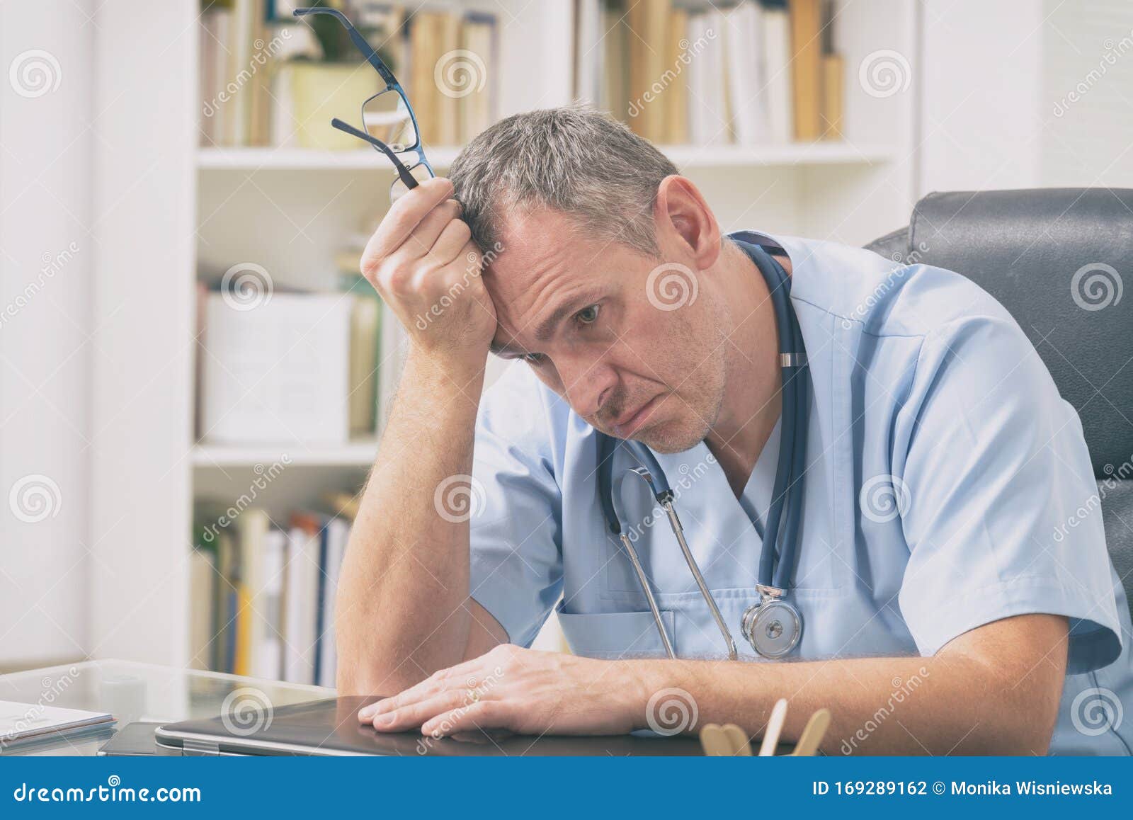 Overworked Doctor in His Office Stock Photo - Image of glasses, crisis ...