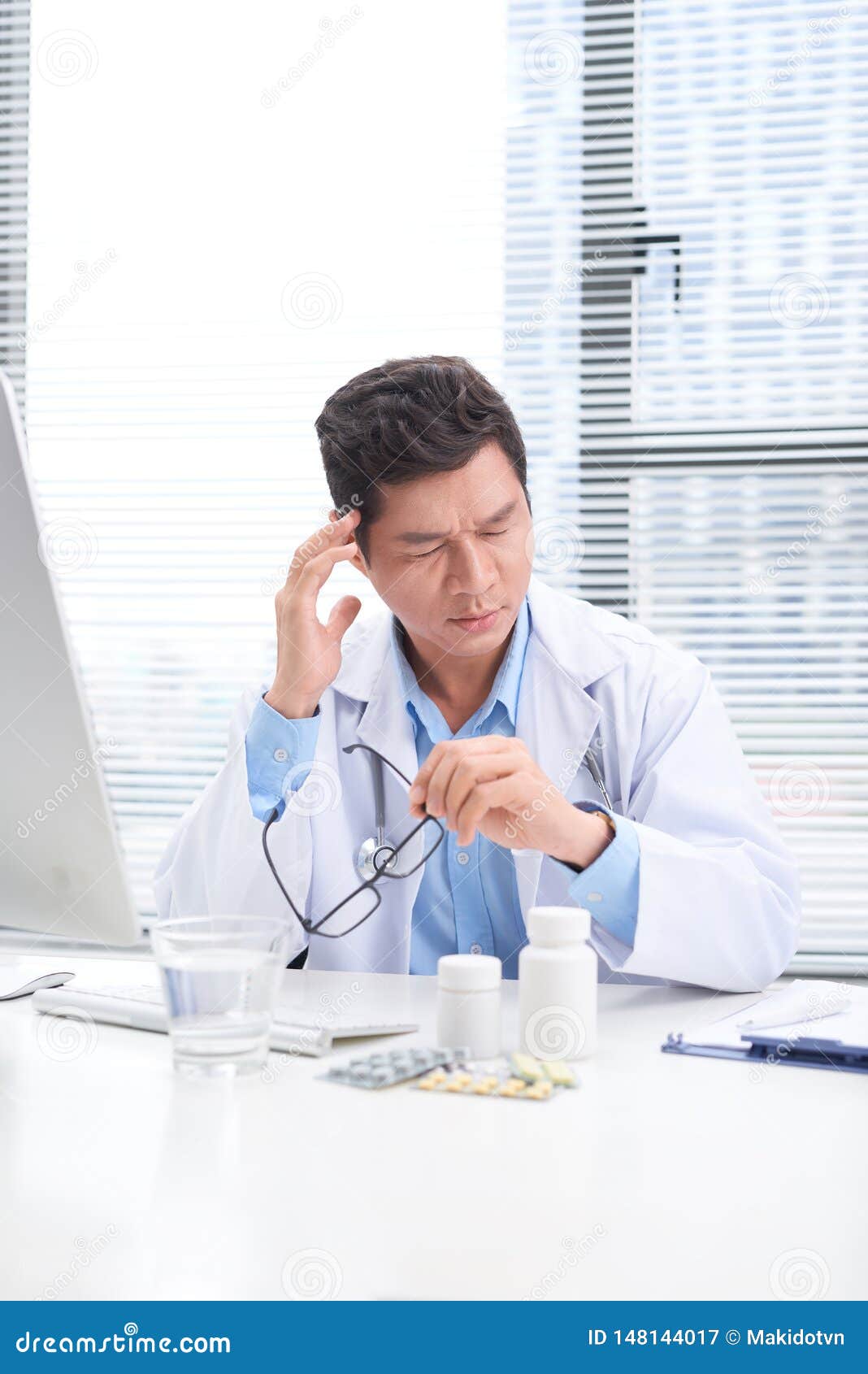 Overworked Doctor Sitting in His Office Stock Image - Image of business ...