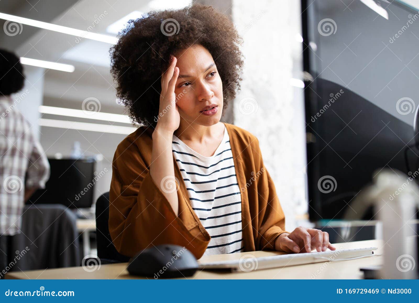 Overworked and Frustrated Young Woman in Front of Computer in Office ...