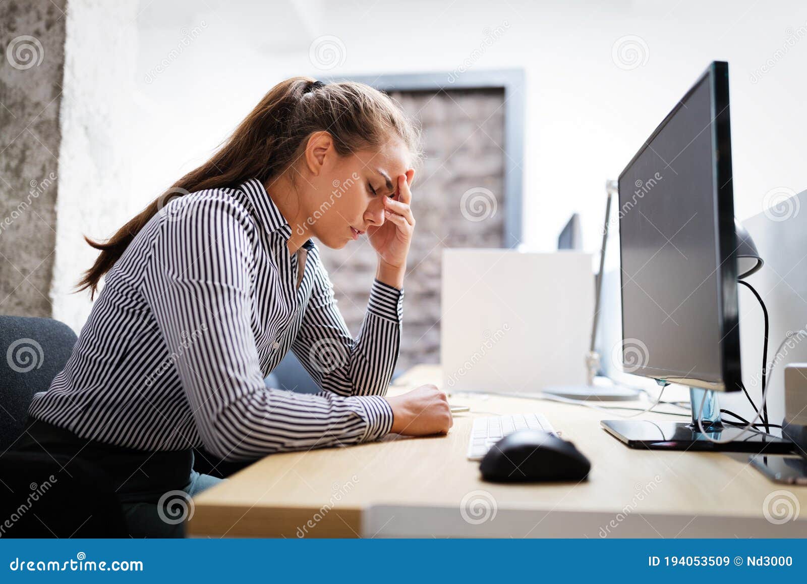 Overworked and Frustrated Young Woman in Front of Computer in Office ...