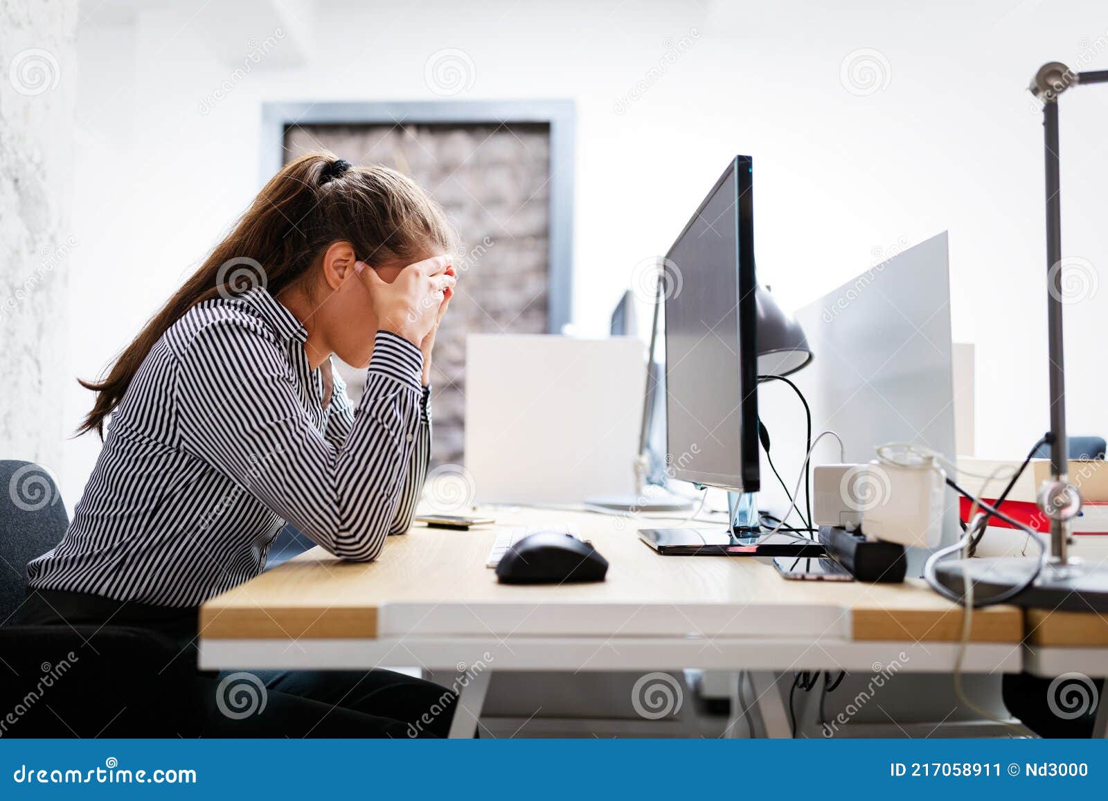 Overworked and Frustrated Young Woman in Front of Computer in Office ...