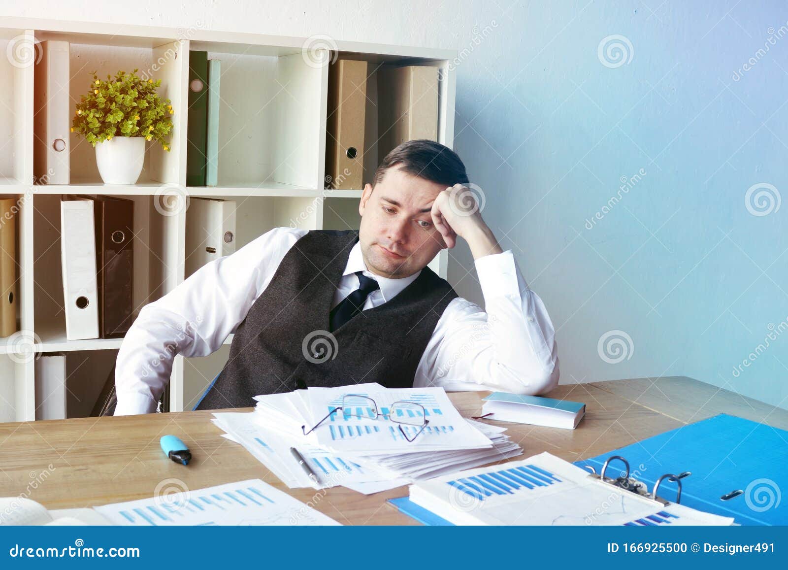 Overworked Man with Stack of Business Papers on the Desk Stock Photo ...