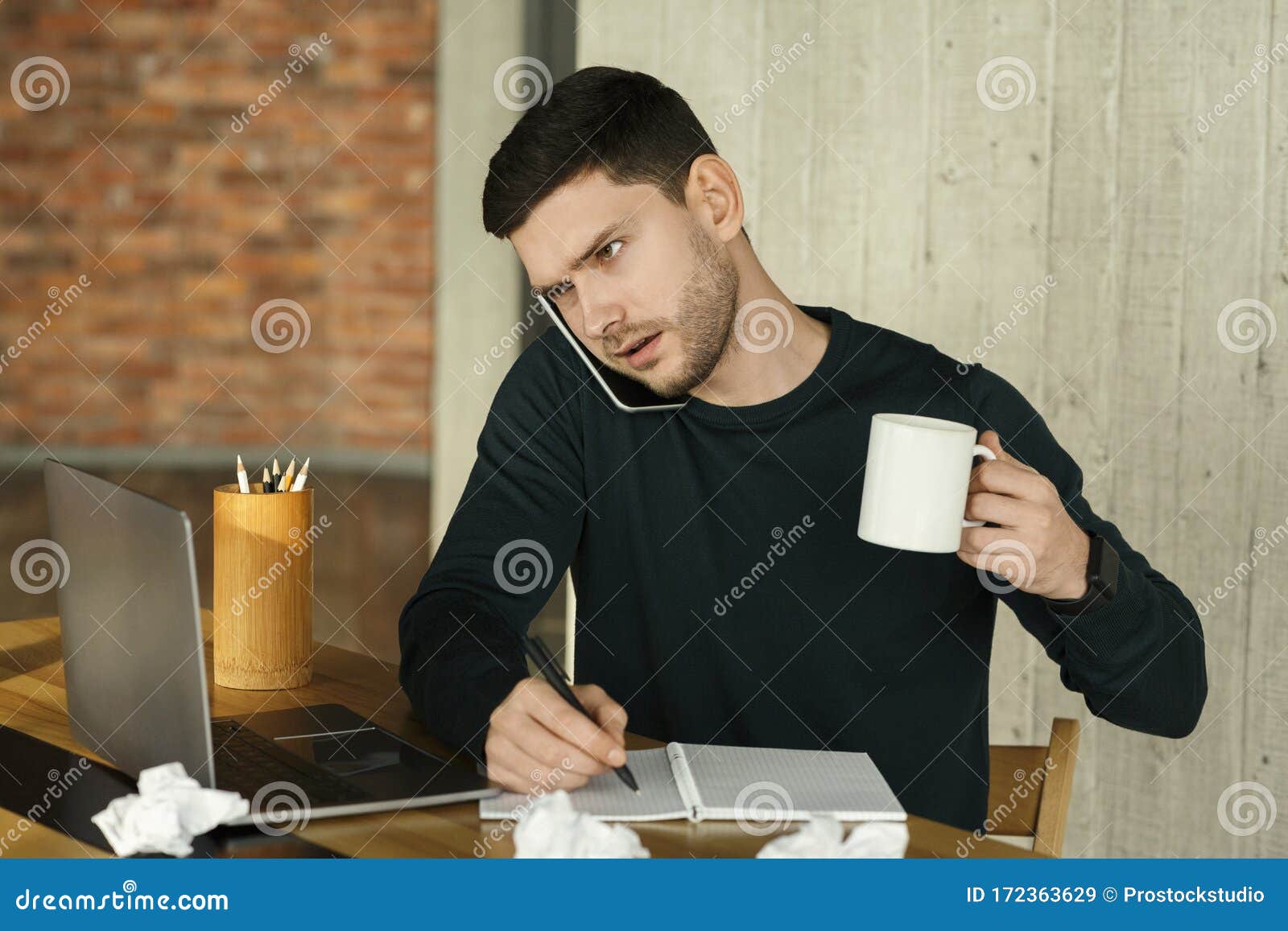 Overworked Office Guy at Laptop Multitasking Working in Office Stock ...