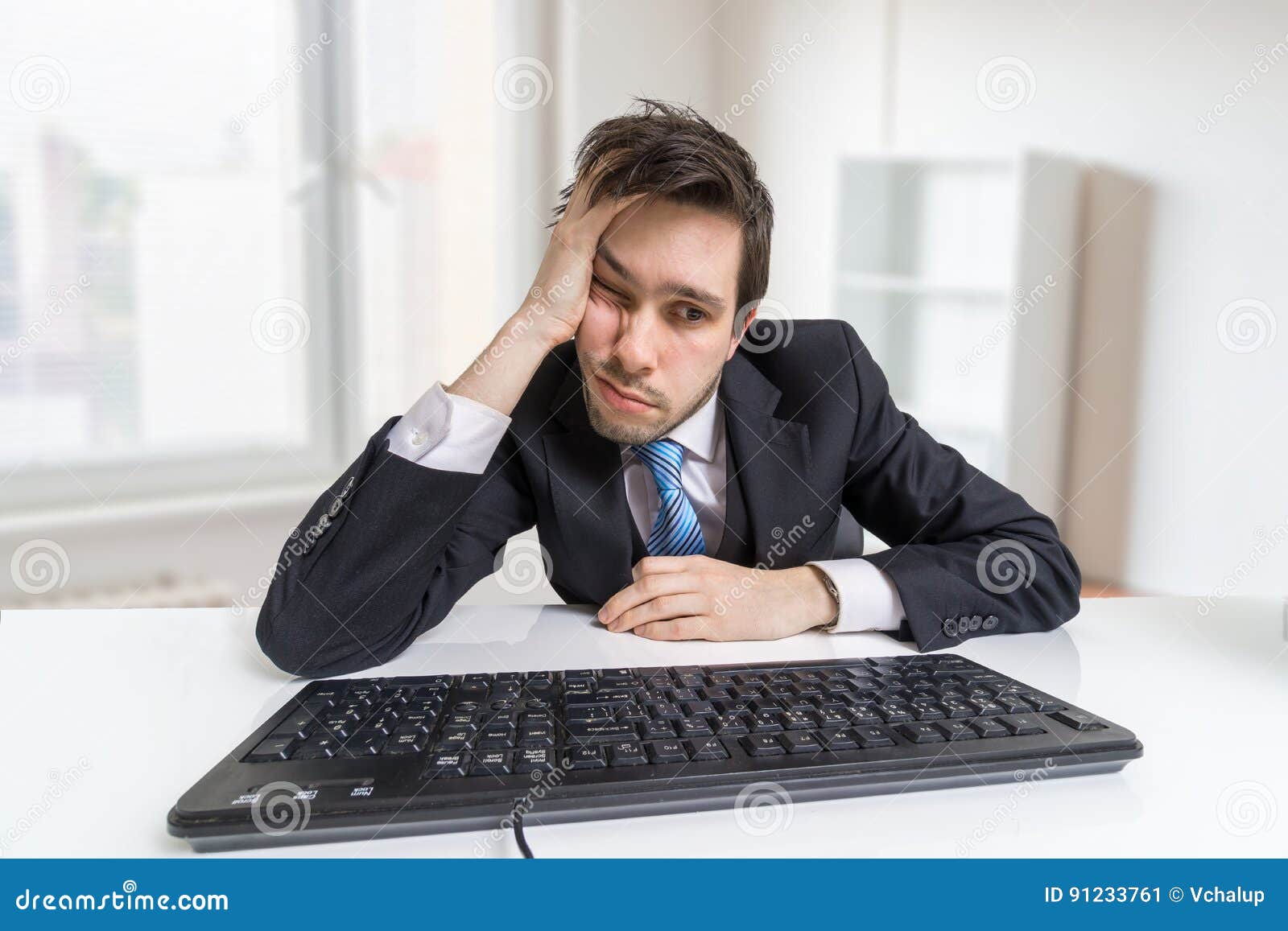 Overworked and Tired Businessman is Working with Computer in Office ...