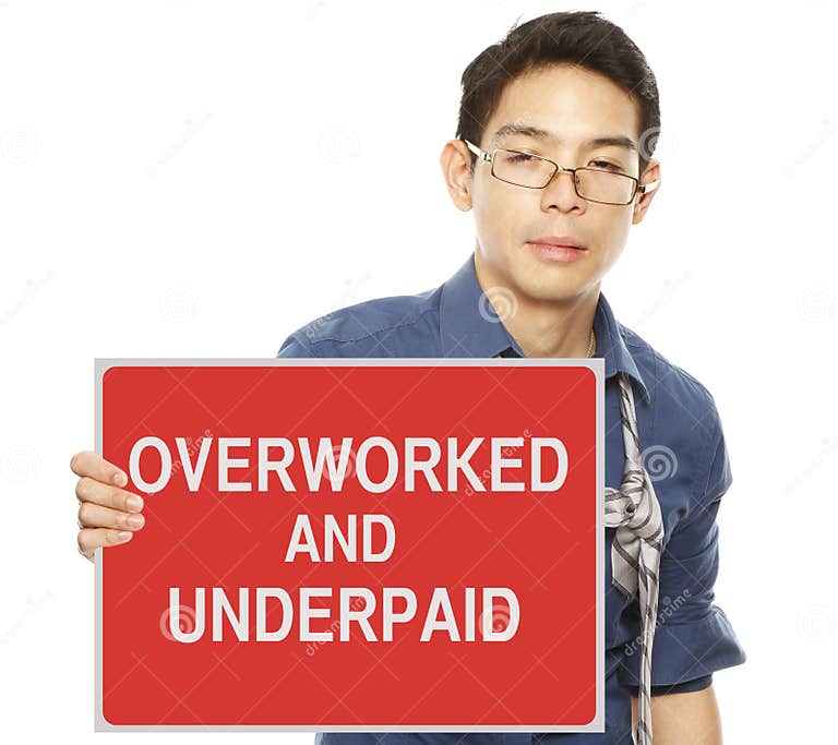 Overworked and Underpaid stock image. Image of signboard - 29442883