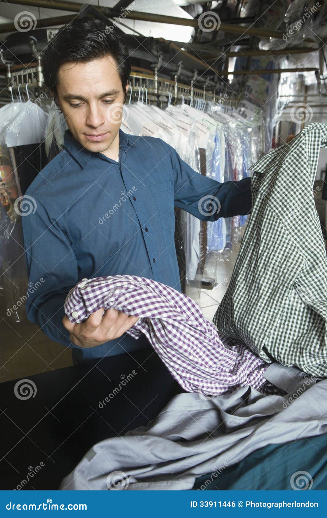 Owner Checking Shirts at Counter in Laundry Stock Photo - Image of ...