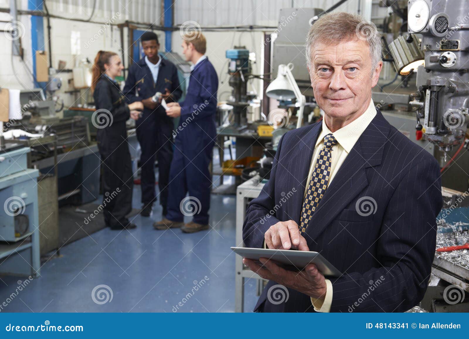Owner of Engineering Factory Using Digital Tablet with Staff in Stock ...