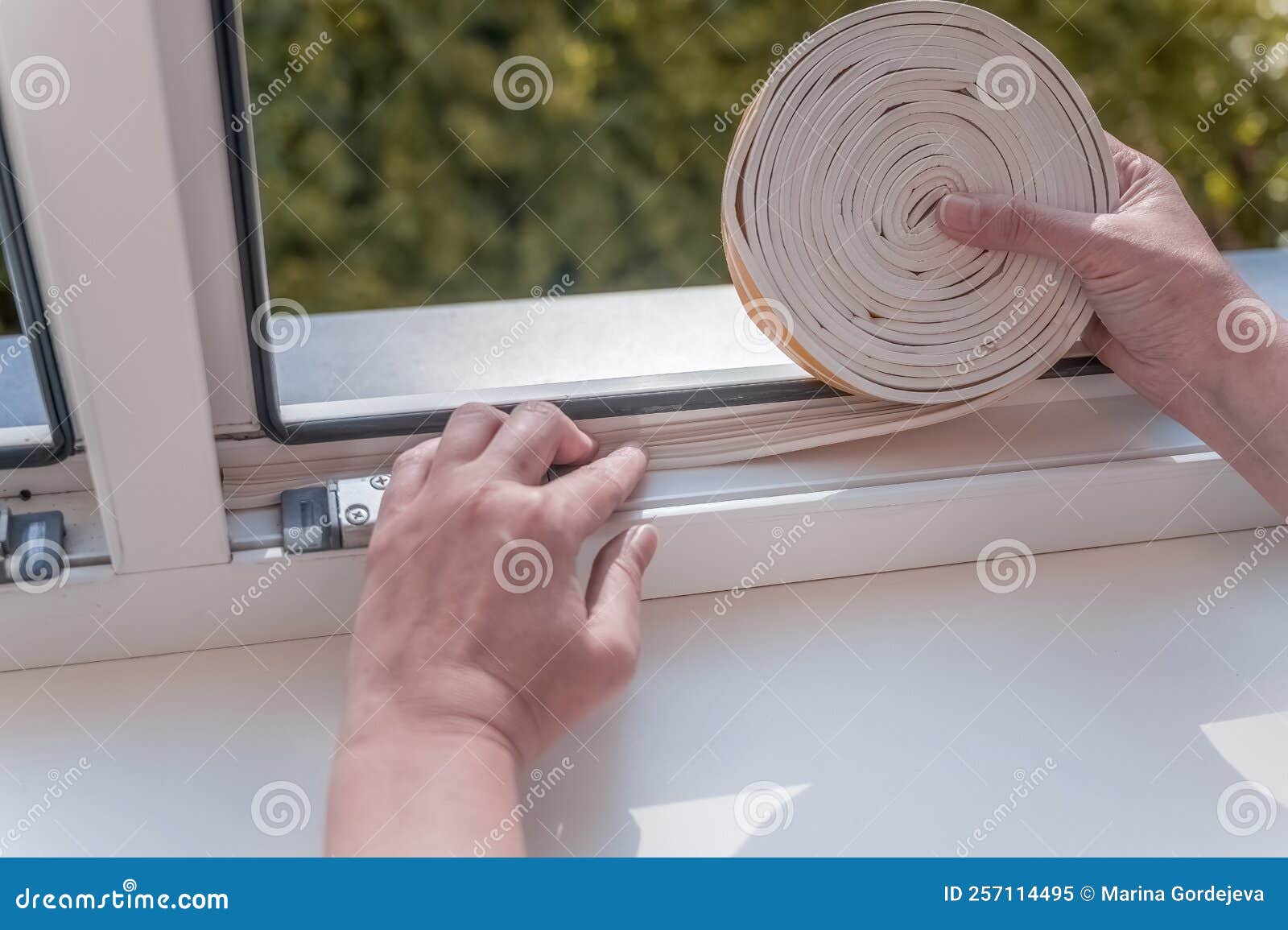 The Owner Puts Sealing Tape on the Window in the House. Single Sided ...