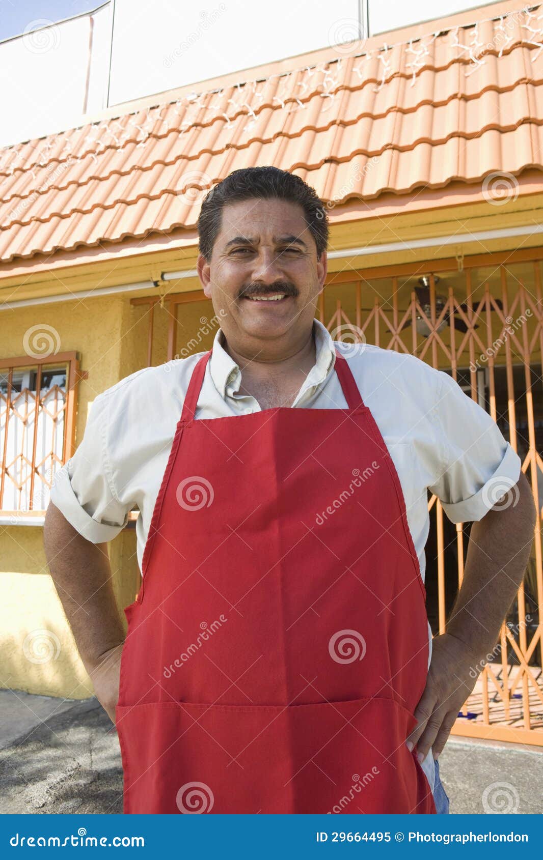 Owner Standing Outside Restaurant Stock Image - Image of latin, apron ...