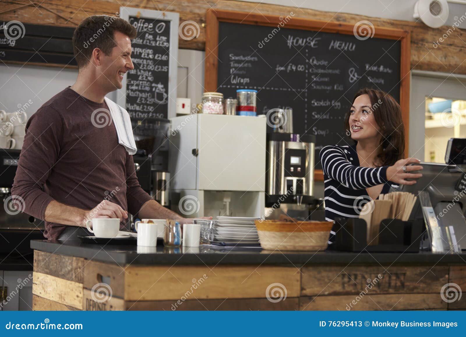 Owners Working Behind the Counter of Cafe Look at Each Other Stock ...