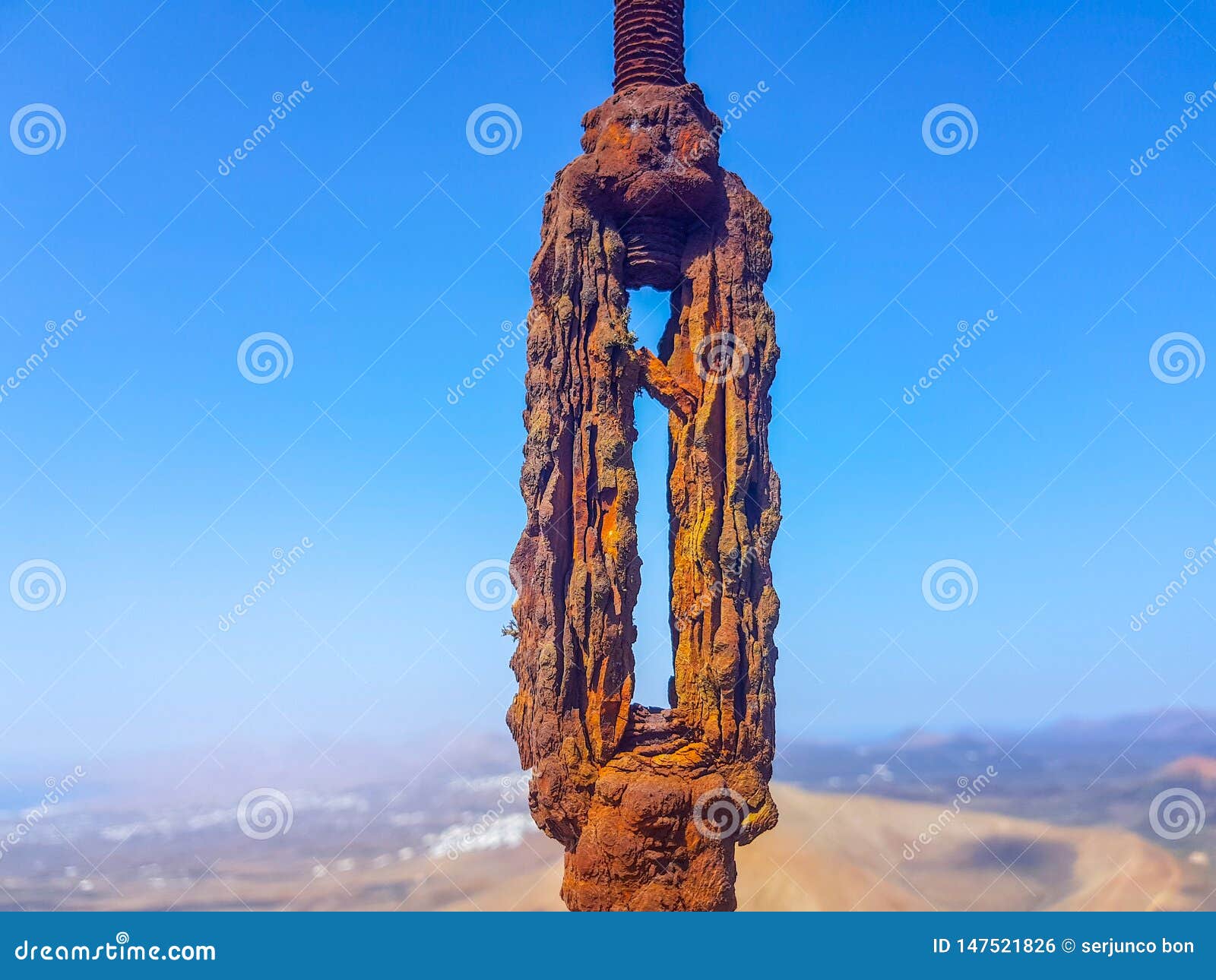 Oxidized Interlocked Wire Loop Cables in the Foreground with Sky and ...