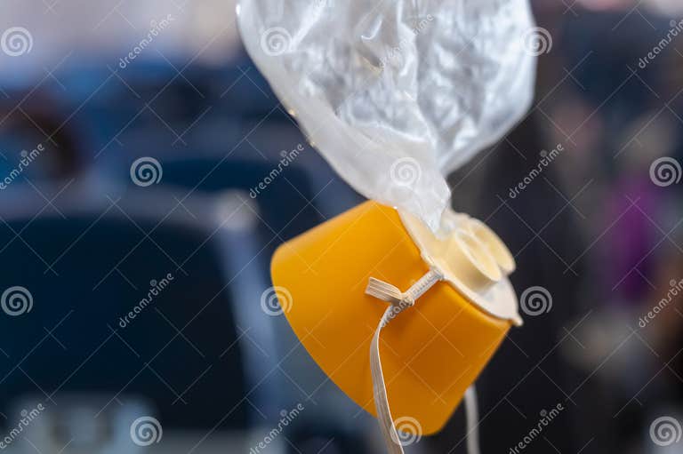 Oxygen Mask Drop from the Ceiling Compartment on Airplane Stock Photo ...