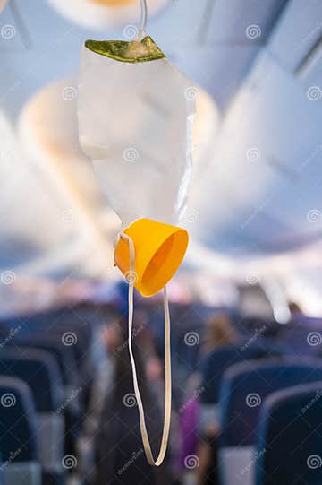 Oxygen Mask Drop from the Ceiling Compartment on Airplane Stock Photo ...