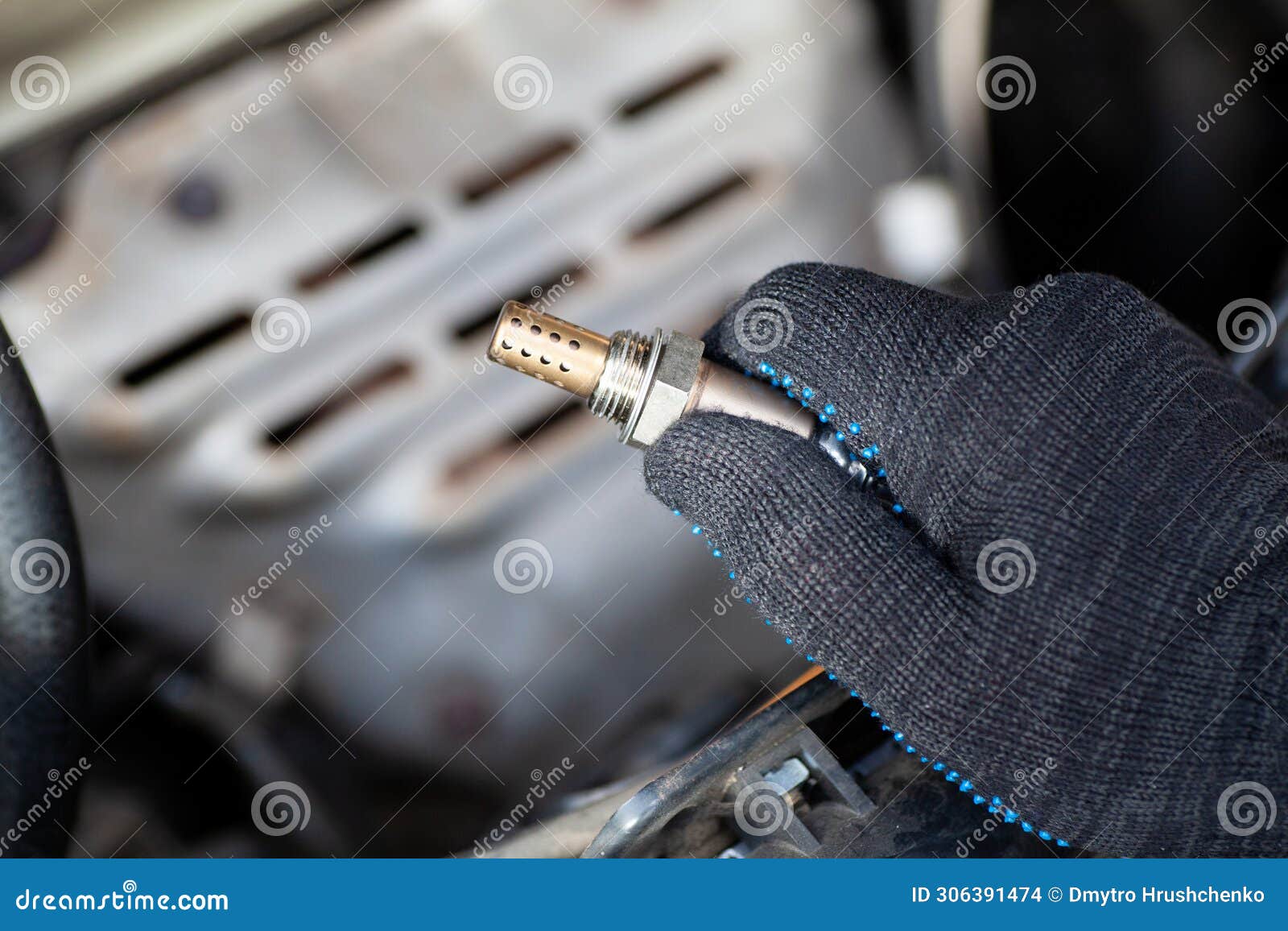 Oxygen Sensor for Gasoline and Diesel Engines in the Hand Against Car ...