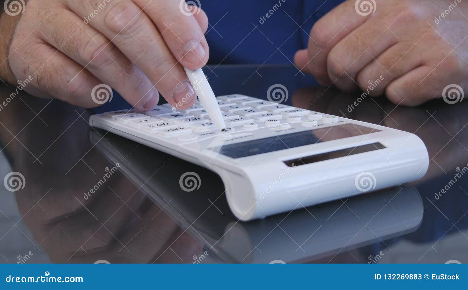 Businessman Calculates Using a Pen and Adding Machine Stock Image ...