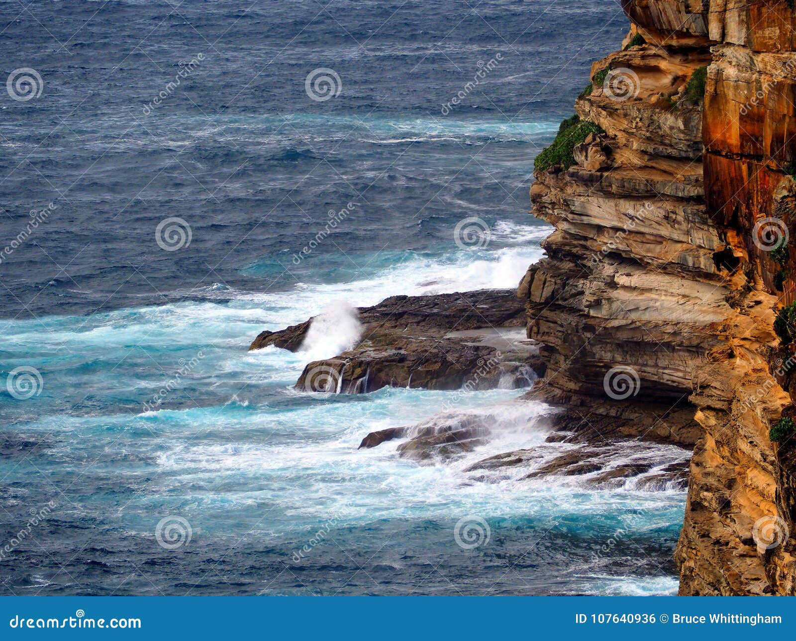 Pacific Ocean Waves Breaking on Rocks at Base of Cliff Stock Photo ...