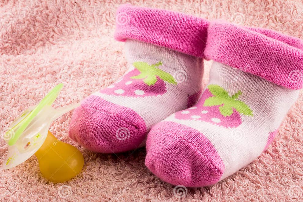 Pacifier and socks stock photo. Image of background, color - 29380544