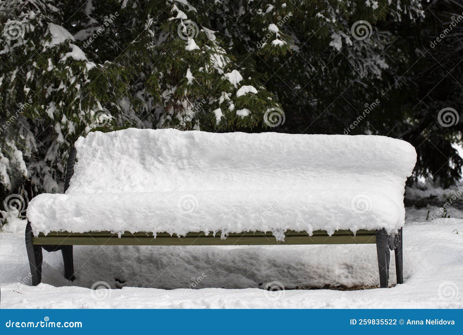 Pack Bench Under Snow As the Snow Continues To Fall for a Wintery Scene ...