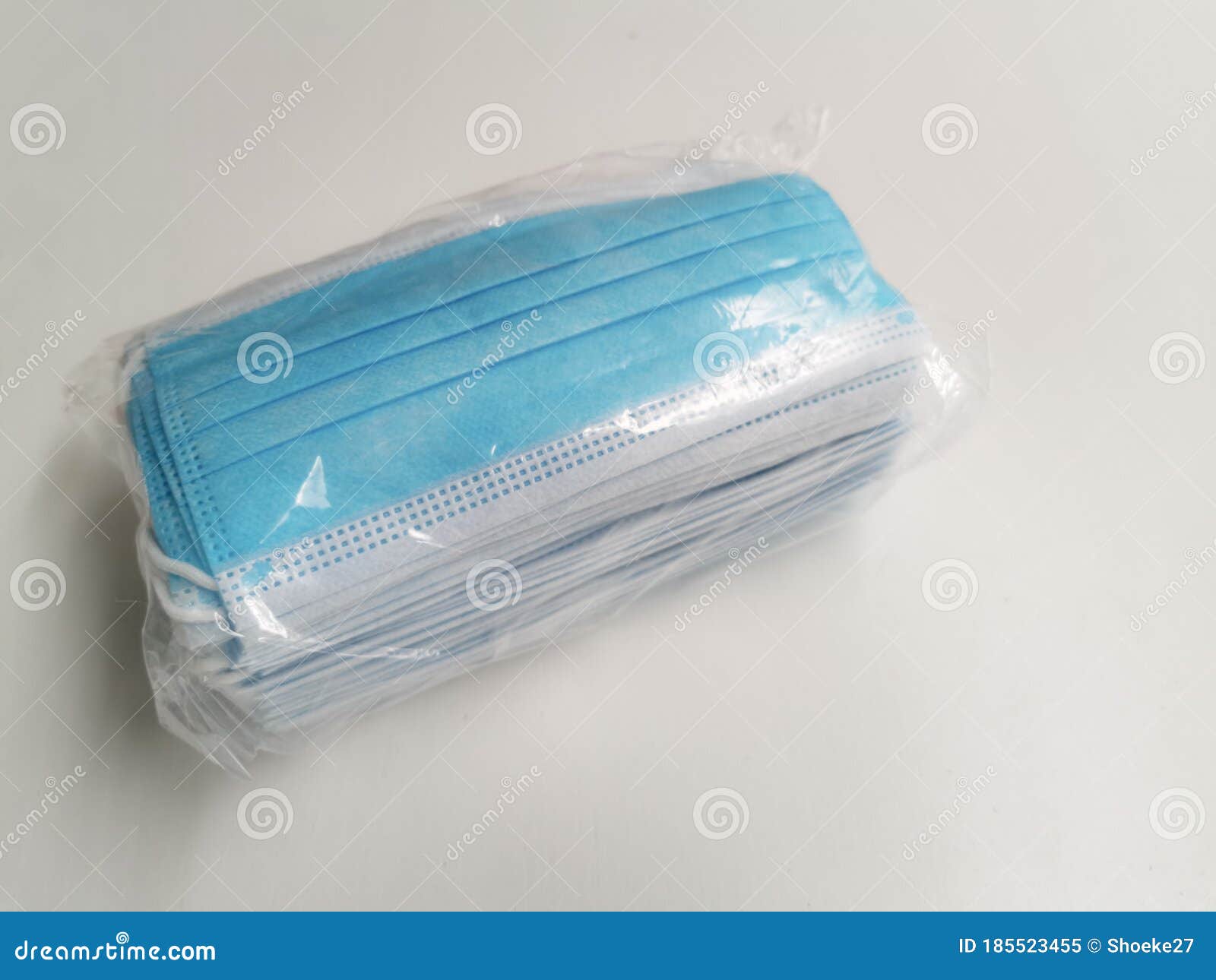 Pack of Blue Disposable Surgical Face Masks on a White Background Stock ...
