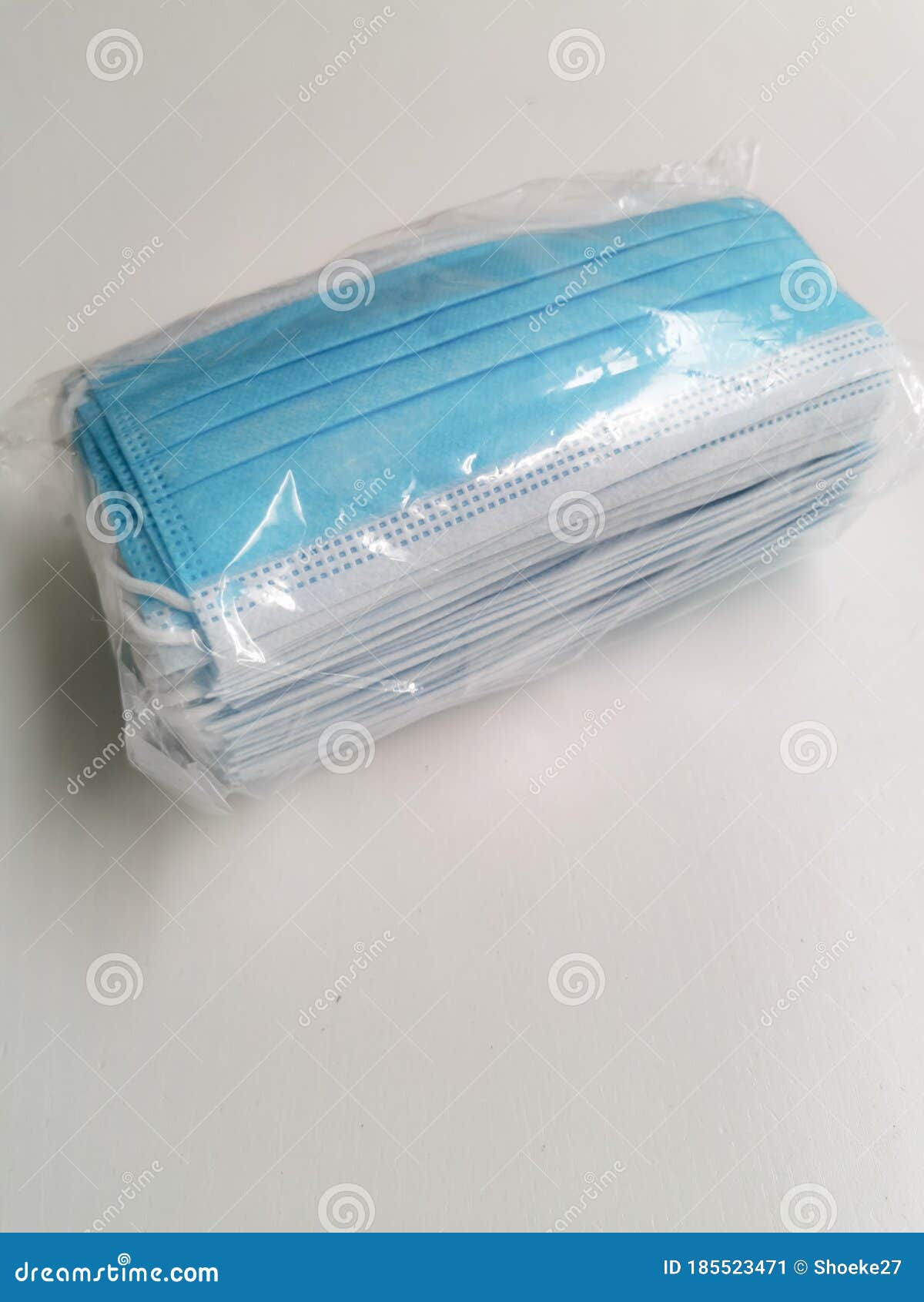 Pack of Blue Disposable Surgical Face Masks on a White Background Stock ...