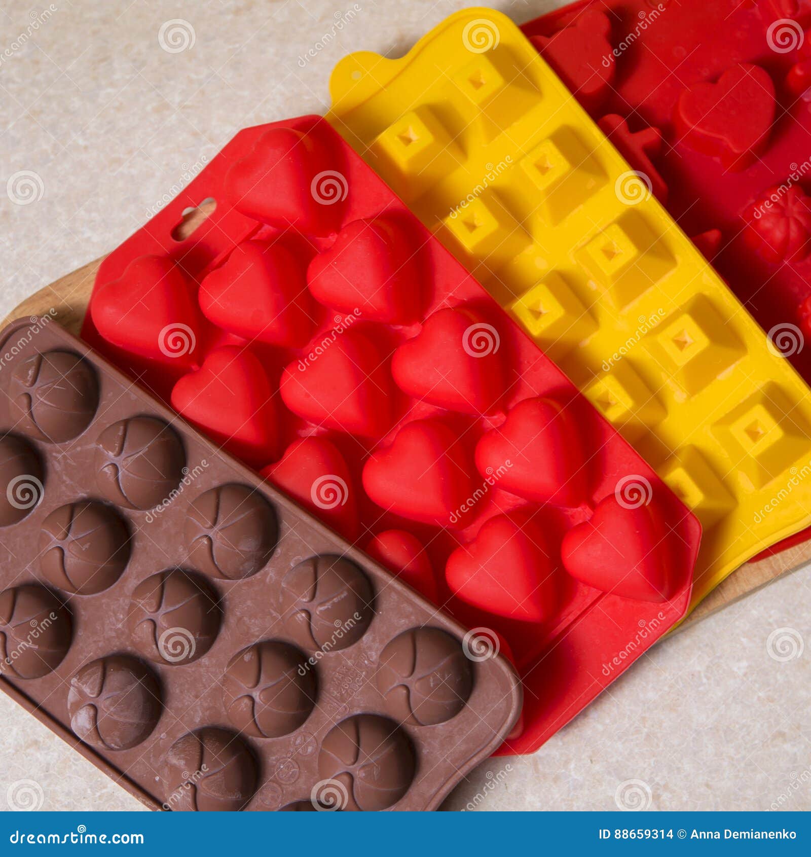 Pack of Chocolate Forms for Homemade Candies on a Neutral Background ...